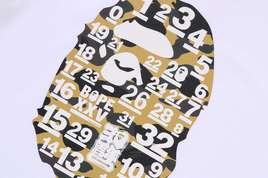 A BATHING APE® A Bathing Ape 32nd Anniv. 1st Camo Big Ape Head Tee ...